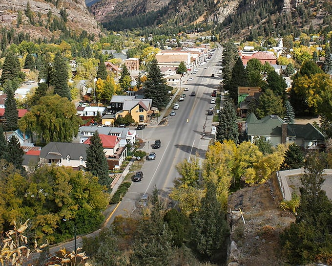The "Switzerland of America" isn't just a nickname—Ouray's mountain-hugged main street proves it with every charming storefront.