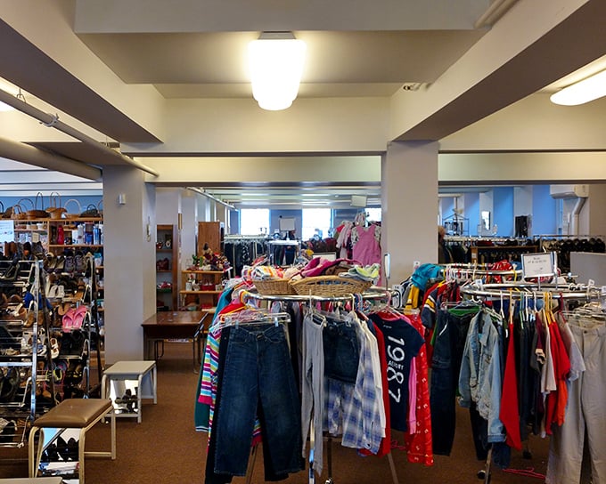 Basement shopping never looked so good – spacious racks and bright lighting transform thrifting into retail therapy.