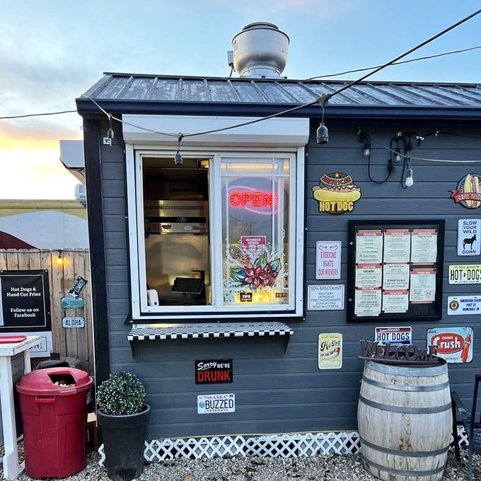 Rustic charm meets hot dog perfection at Street Dogs. Those wooden barrels aren't just for show—they're for resting your elbows while you devour.