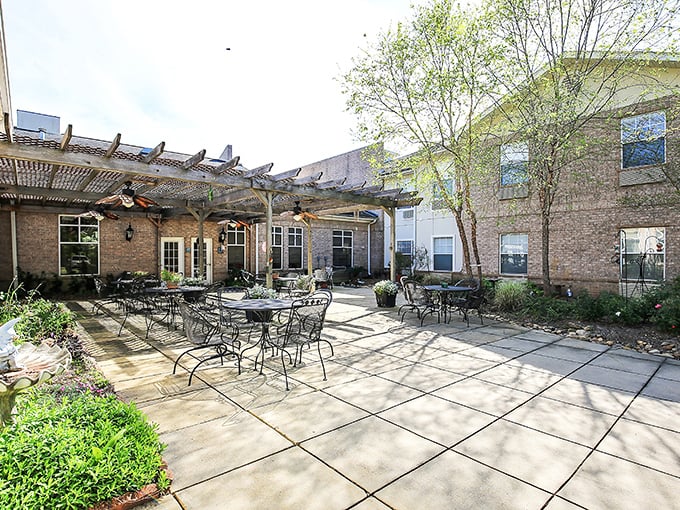 This outdoor patio at The Waterford isn't just a space—it's where afternoon conversations turn strangers into lifelong friends.