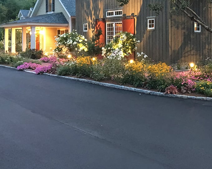 Evening gardens aglow with string lights create the kind of ambiance Norman Rockwell would paint for a Saturday Evening Post cover.