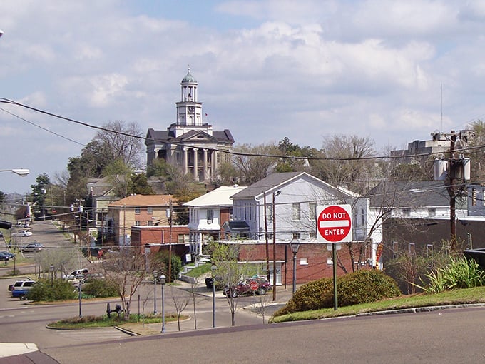 The old courthouse rises above the rooftops like a guardian watching over this historic river town's treasures.
