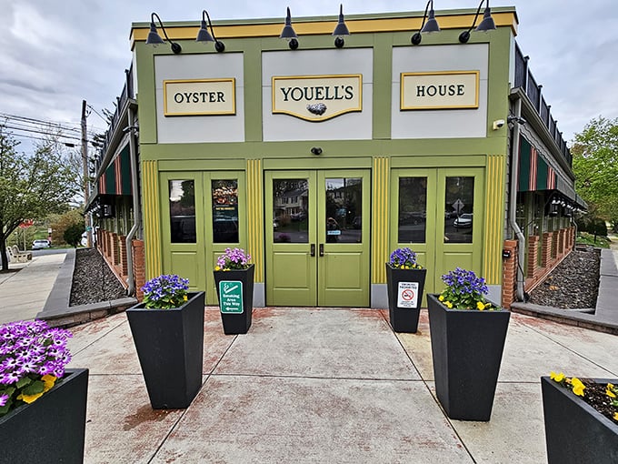 The cheerful green facade of Youell's stands ready to welcome seafood lovers like an old friend.