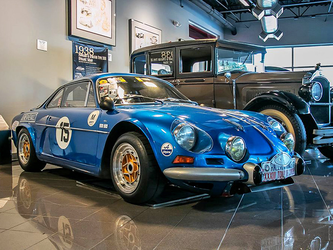 This blue Alpine-Renault A110 looks ready to zoom off its pedestal. Racing number 15 suggests it has stories to tell about hairpin turns and checkered flags.