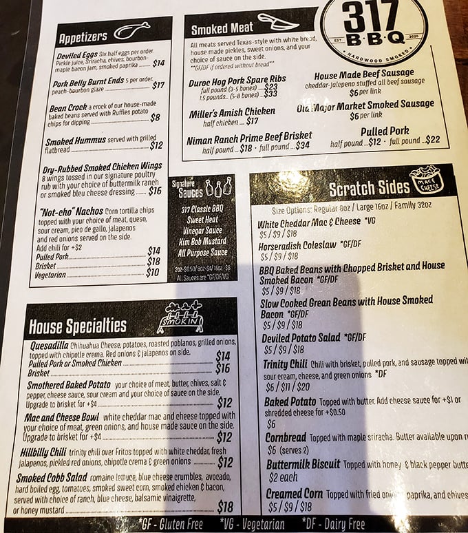 The menu reads like barbecue poetry – Niman Ranch brisket, Duroc hog ribs, and something mysteriously wonderful called "Bean Crack" that demands investigation.