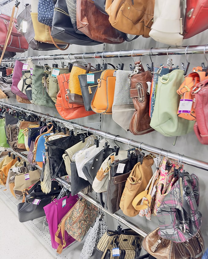 Handbag heaven or purse purgatory? Either way, these colorful leather companions hang like exotic fruit, ripe for the picking.
