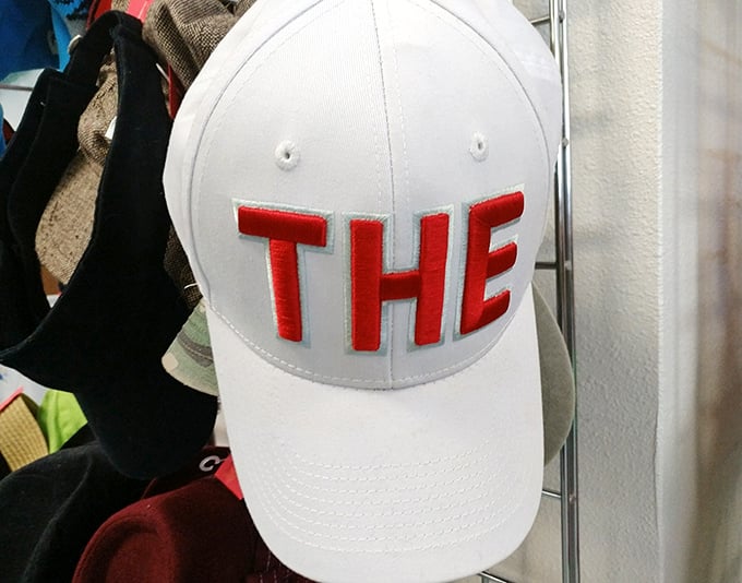 Just "THE" hat—because sometimes simple statements make the boldest fashion declarations in a thrift store treasure hunt.