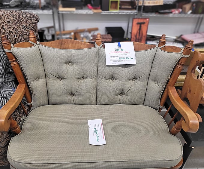 This tufted loveseat isn't just furniture—it's someone's future reading nook, waiting to cradle its next owner through countless novels.