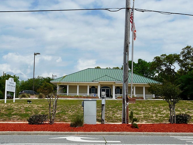 The Courthouse Annex stands as a testament to practical Florida architecture – metal roof to shed the rain, wide porch to catch the breeze, zero waiting lines inside.
