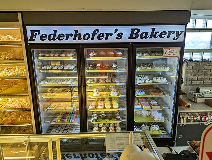 This refrigerated case isn't just storing desserts—it's preserving happiness. Each shelf offers a different pathway to what therapists call "food-induced euphoria."