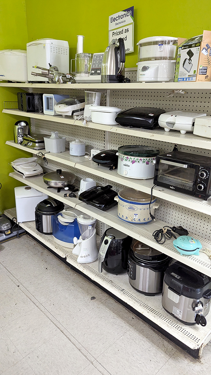 The lime-green electronics section wall practically screams, "Someone's barely-used wedding gift could become your kitchen MVP!"