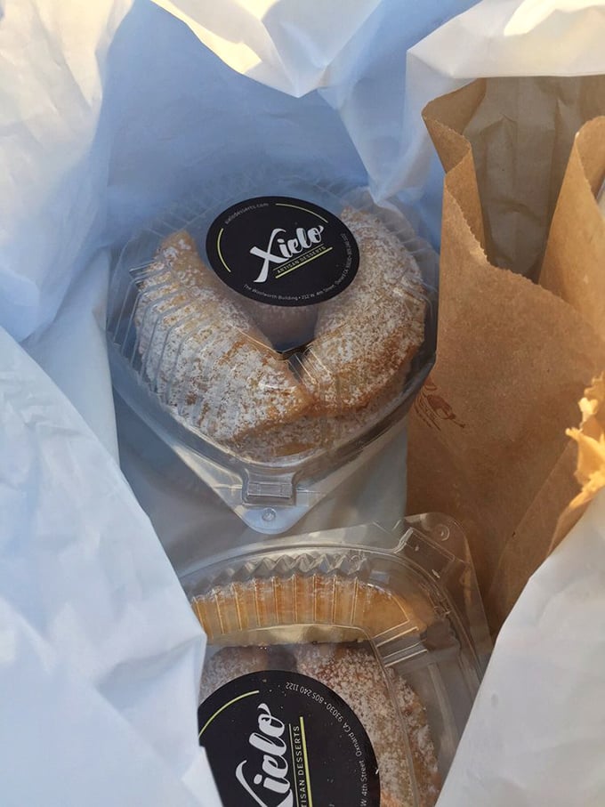 Desserts packaged with care, like little treasures waiting to be discovered. That dusting of powdered sugar isn't decoration—it's a promise.