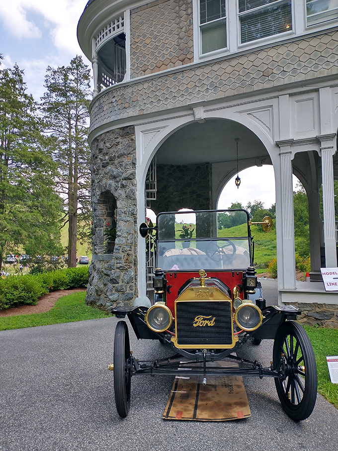 This crimson Model T isn't just a car—it's America's first love affair with the open road, proudly displaying its gold Ford emblem like a family crest.