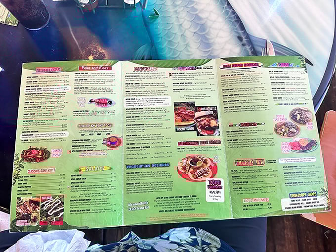 The menu unfolds like a treasure map, with X marking the spot for everything from blackened mahi to those legendary coconut shrimp.