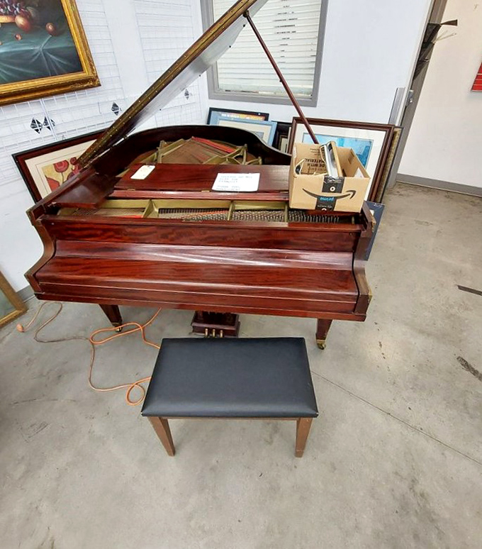 This baby grand piano isn't just furniture—it's waiting for its next concerto. Imagine the stories it could tell about its previous performances.