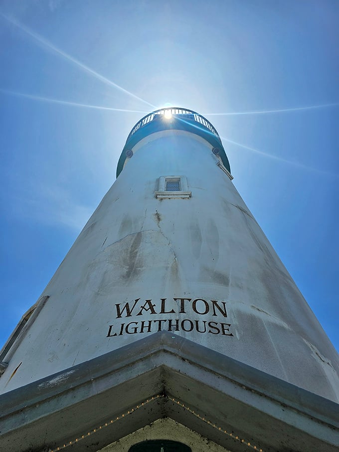 Looking up at Walton Lighthouse like it's the main character in its own coastal drama, which honestly, it is.