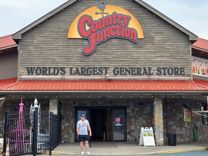 The stone entrance beckons shoppers like a country castle, complete with funnel cake stand – because shopping is officially a tourist attraction here.