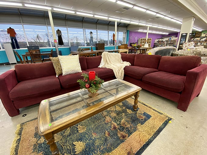 This burgundy sectional staged with throw pillows isn't just furniture—it's your next Netflix marathon headquarters waiting to happen.
