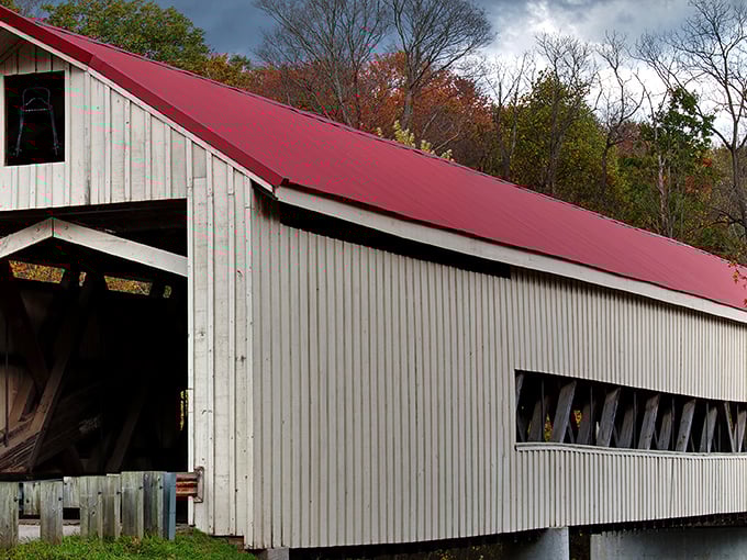 Not just a pretty face, this covered bridge combines rustic charm with practical purpose – keeping winter snow off the roadway and photographers thoroughly delighted.