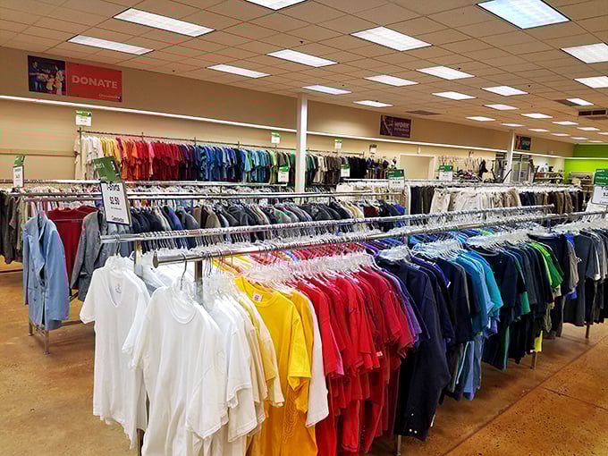 Color-coordinated clothing racks stretching into infinity—finally, a rainbow you can actually wear to your nephew's wedding.