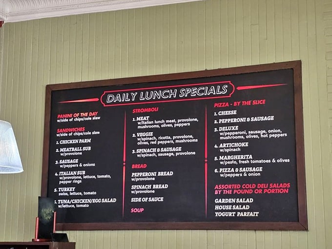 The menu board reads like a love letter to Italian comfort food—stromboli, panini, and pizza that make choosing just one item the day's most delightful challenge.
