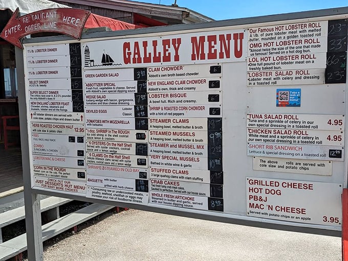 The menu board stands like Moses' tablets for seafood lovers—commandments of deliciousness carved into a roadmap of oceanic pleasure.
