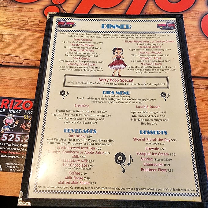 The menu reads like a love letter to classic Americana – Betty Boop specials, Route 66 Ribeye, and malted milkshakes that would make Archie and Jughead swoon.