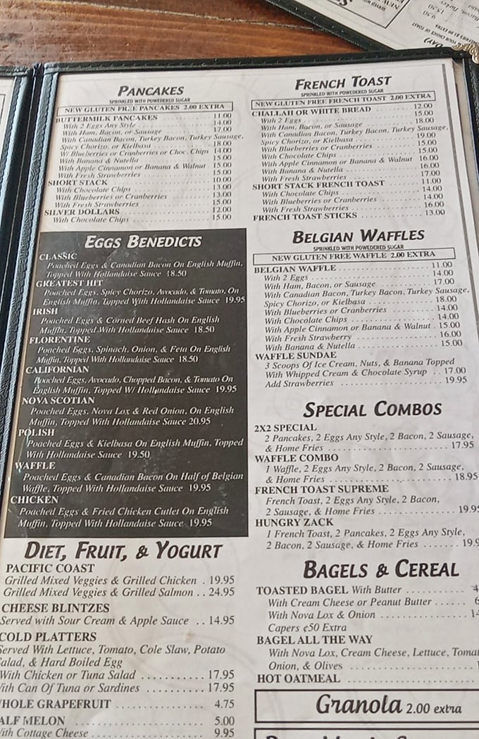 This menu isn't just reading material—it's a novel of possibilities where breakfast reigns eternal and eggs Benedict variations get their own chapter.