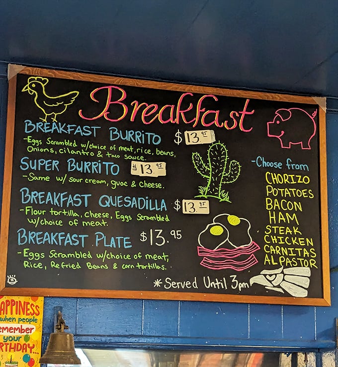 The breakfast menu board is a morning masterpiece, promising chorizo, carnitas, and al pastor before most people have had their coffee.