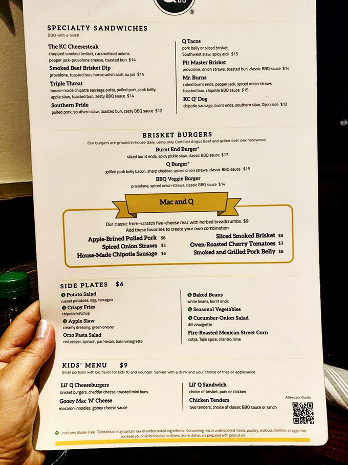 The menu reads like barbecue poetry – each specialty sandwich and brisket burger promising a different path to smoked meat nirvana.