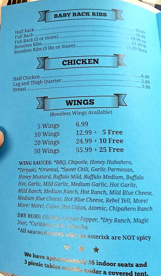 The menu at Curt's reads like a carnivore's dream journal. Just look at those wing sauce options—more varieties than my cable package!