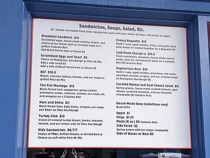 The menu board reads like a love letter to your appetite—sandwiches on house-baked bread that make chain delis weep with inadequacy.