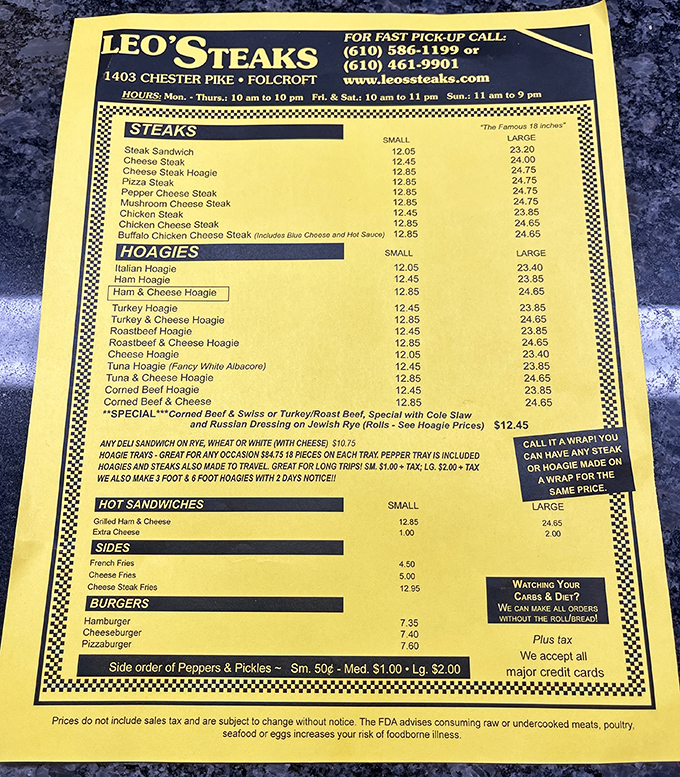 The yellow menu board—a treasure map to sandwich paradise. Notice how "Cheese Steak" appears first, like the headliner at a rock concert.