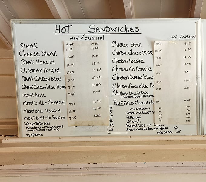 The handwritten menu board tells you everything you need to know—this place doesn't waste time on fancy descriptions when they could be making more sandwiches instead.