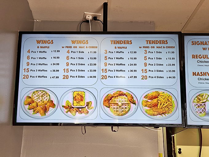 The menu board tells a delicious story—wings, tenders, and waffles in perfect harmony, like a culinary jazz trio.