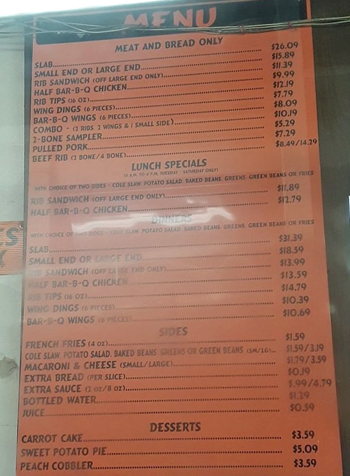 The menu board – a sacred text of smoked meat possibilities. Notice how "SLAB" sits at the top like the barbecue royalty it is.