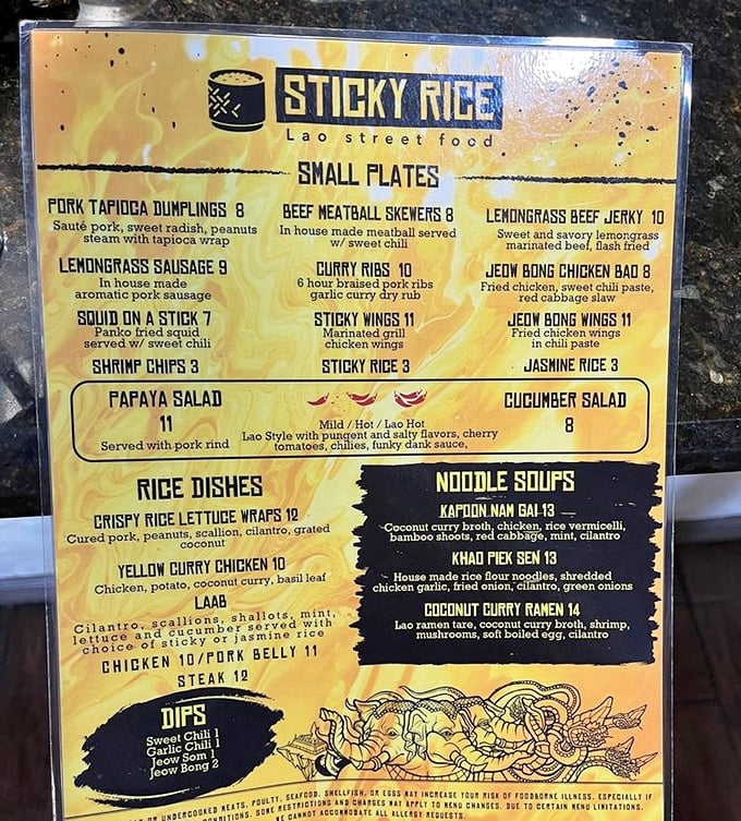 The menu reads like a treasure map of Laotian delights, with each description promising a new adventure for your taste buds.