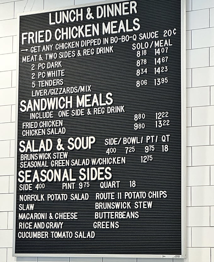 This menu board isn't just a list—it's a roadmap to happiness. Each line represents a different path to culinary bliss, from dark meat to butterbeans.