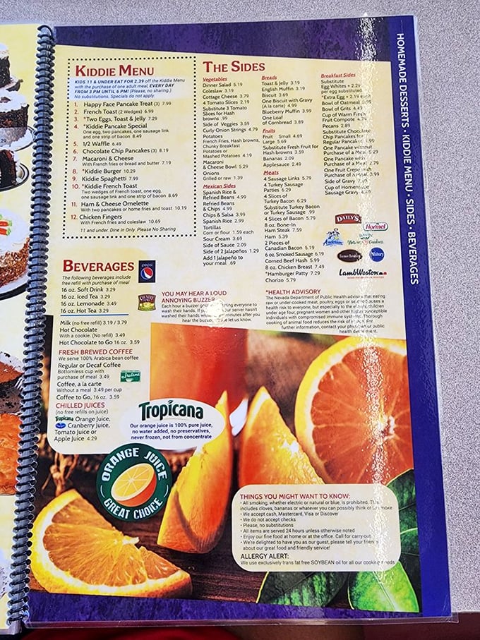 The spiral-bound menu—a sacred text of breakfast possibilities that makes choosing just one item feel like Sophie's Choice with syrup.