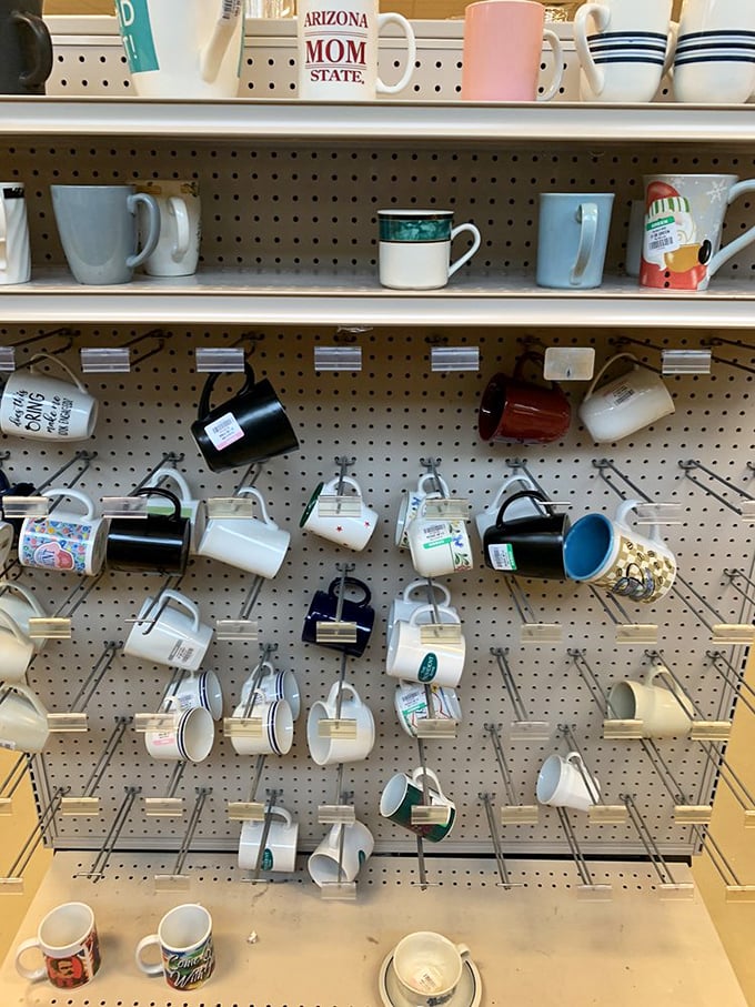 The mug wall: where coffee vessels from far-flung vacations and forgotten corporate events find their second chance at caffeinated glory.