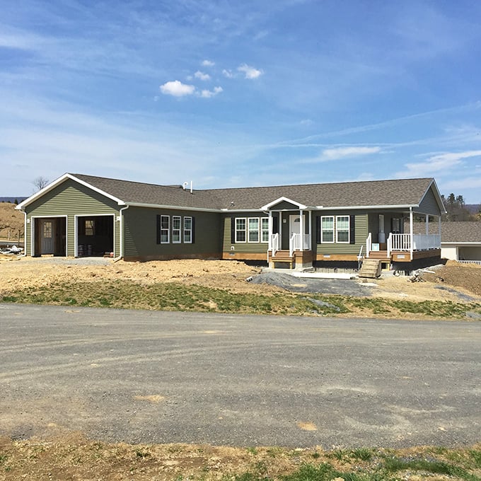 Fresh beginnings take shape in this newly constructed home. The welcoming porch and clean lines promise comfortable living without the mansion-sized maintenance headaches.