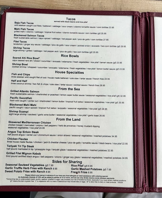 The menu reads like a love letter to the ocean – blackened salmon tacos and Pacific swordfish promising maritime magic on every plate.
