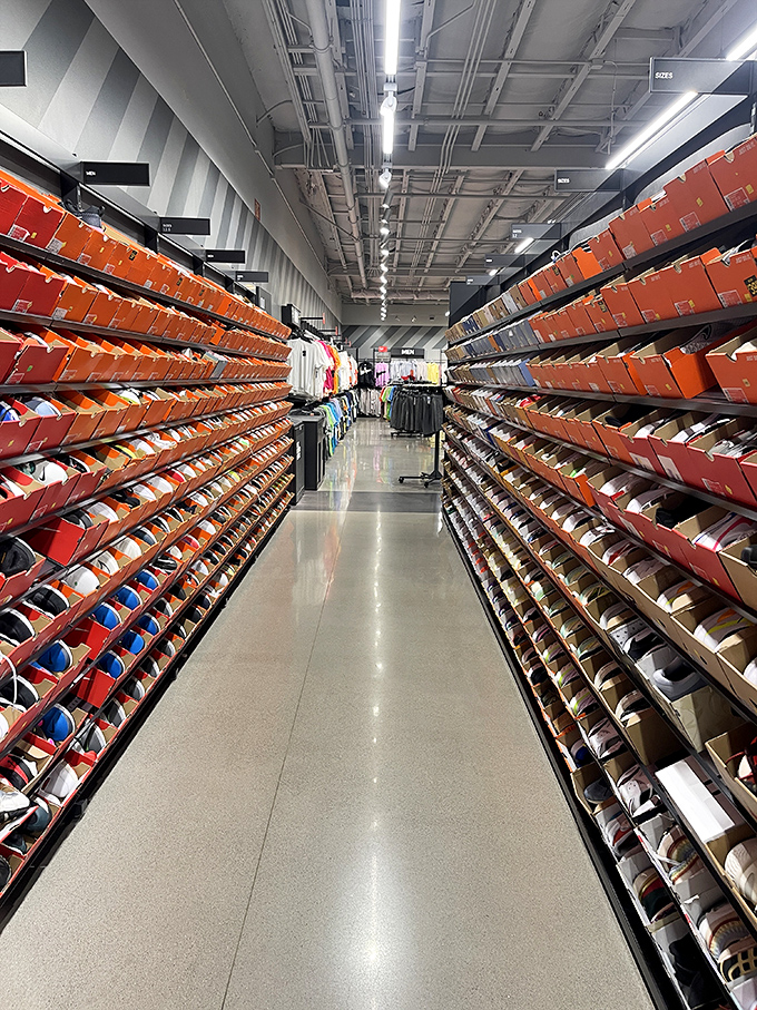 The Nike Factory Store's wall of shoes—where sneakerheads find nirvana and everyone else suddenly realizes they "need" new footwear.