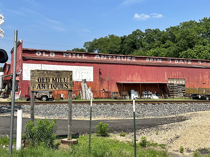 Old Mill Antiques isn't just weathered – it's earned those rustic red boards through decades of housing treasures that someone's spouse definitely called "just more junk."