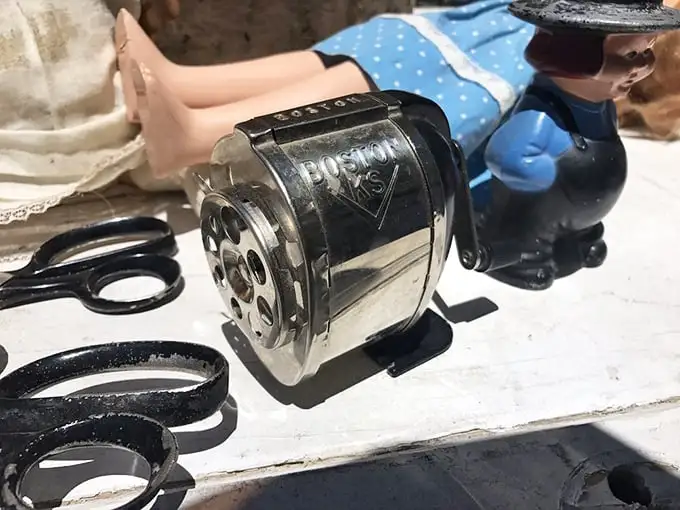 That vintage Boston pencil sharpener isn't just office equipment—it's a time machine to when sharpening a pencil was a satisfying mechanical symphony.