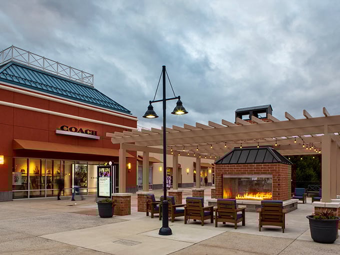 The outdoor fireplace lounge at Coach isn't just a place to rest—it's where shopping stamina is recharged and relationships are saved. 