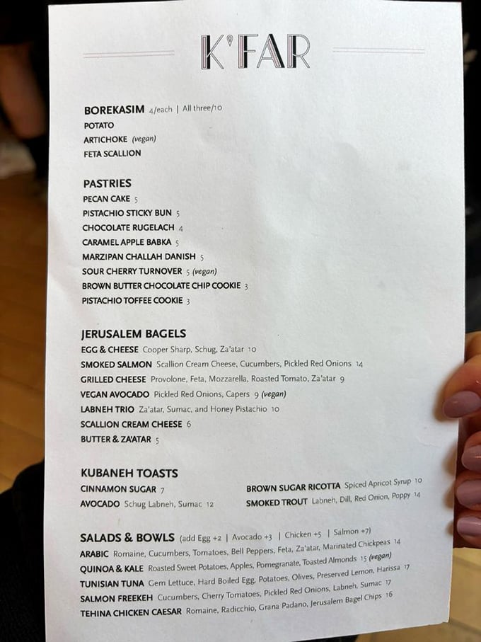 The menu reads like a love letter to Israeli cuisine – each item a chapter in a delicious story you can't wait to devour.