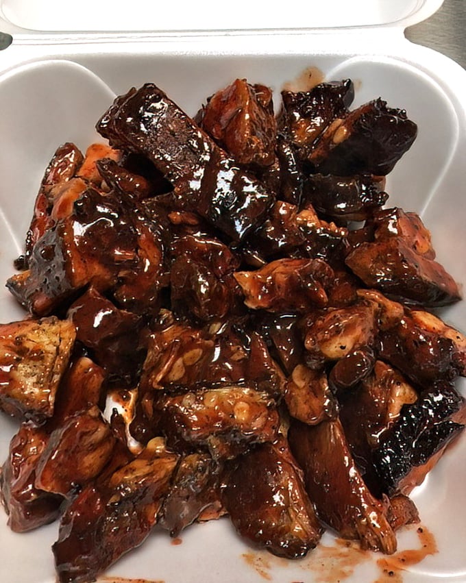 Glistening with sauce and packed with flavor, these rib tips aren't just food—they're edible evidence that patience and smoke create magic.