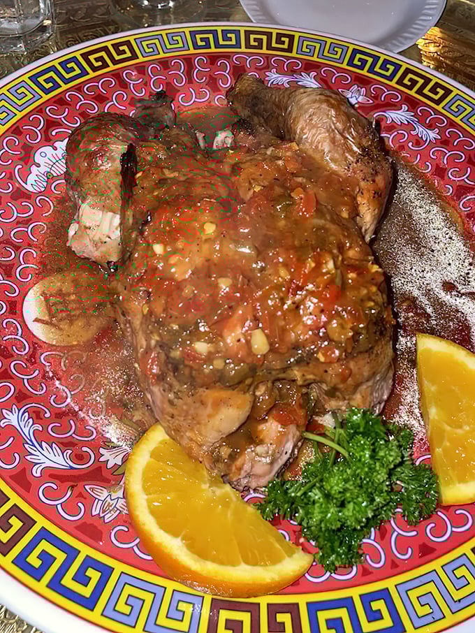 This isn't just chicken—it's a masterclass in Moroccan spices, with tender meat bathed in a sauce that balances savory and sweet notes, garnished with bright citrus.