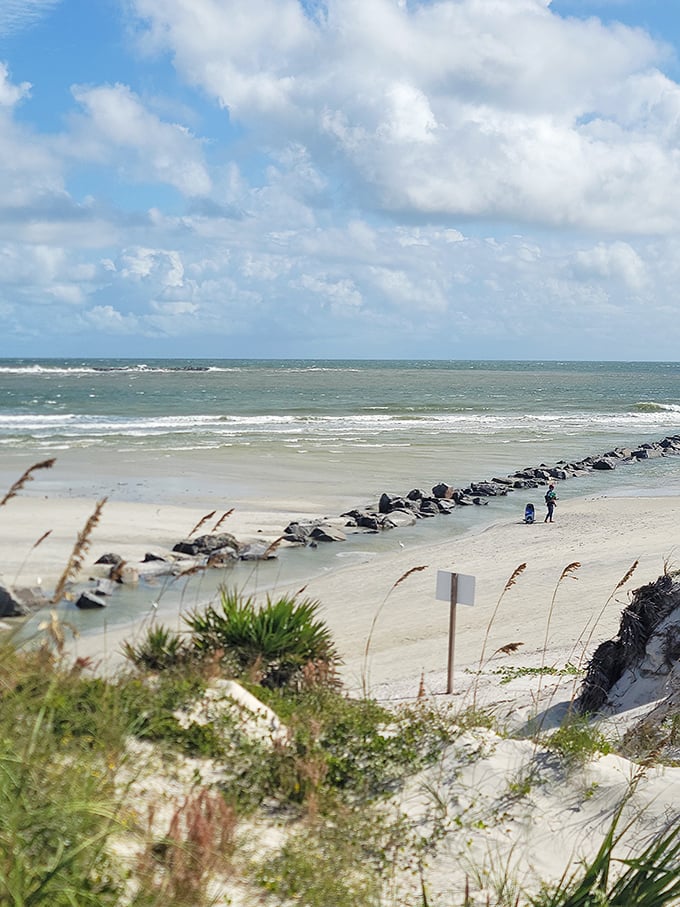 Where sky meets sea at Smyrna Dunes Park. Those tiny figures on the jetty aren't measuring the distance to Cuba—they're measuring their good fortune. 